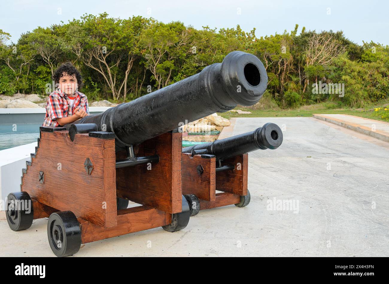 Portrait of a child boy in ancient cannon, Cayo Santa Maria, Villa ...