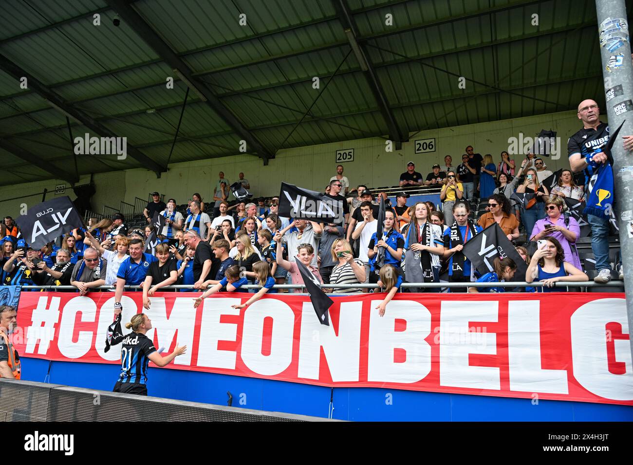 fans and supporters of Club YLA celebrate after winning a female soccer ...