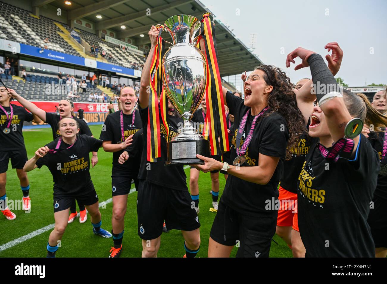 players of Club YLA celebrate after winning a female soccer game ...