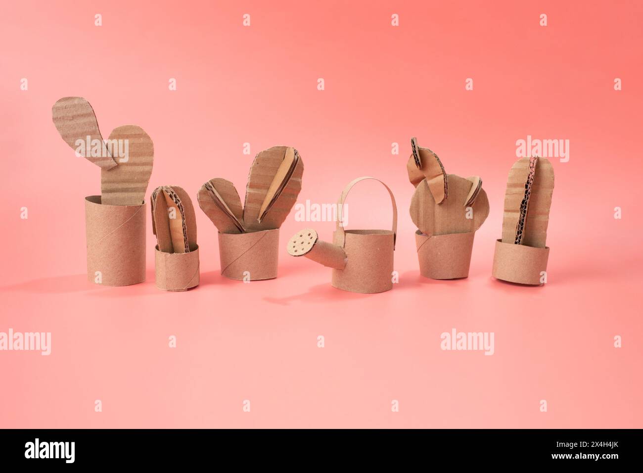 DIY cactus made cardboard, against pink background Stock Photo - Alamy