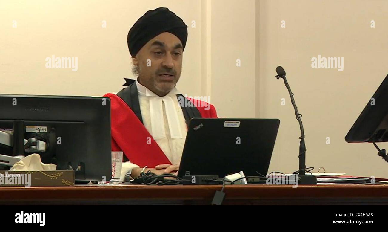 Screengrab of Mr Justice Saini at Bristol Crown Court, sentencing 16 ...