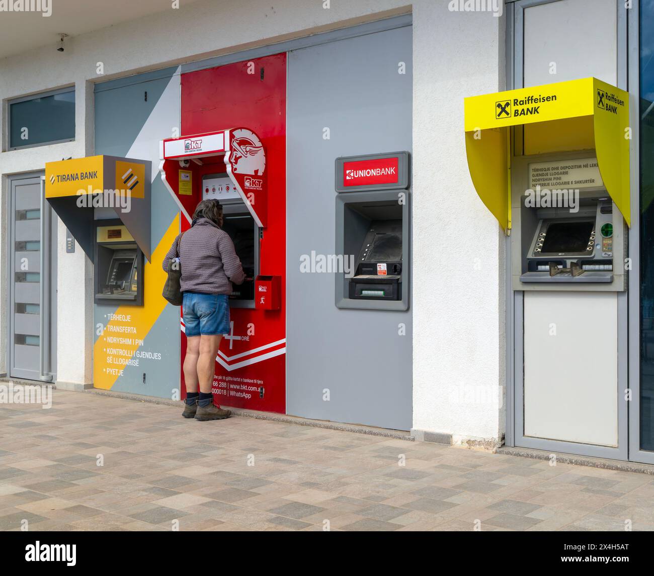 Woman raiffeisen bank atm hi-res stock photography and images - Alamy
