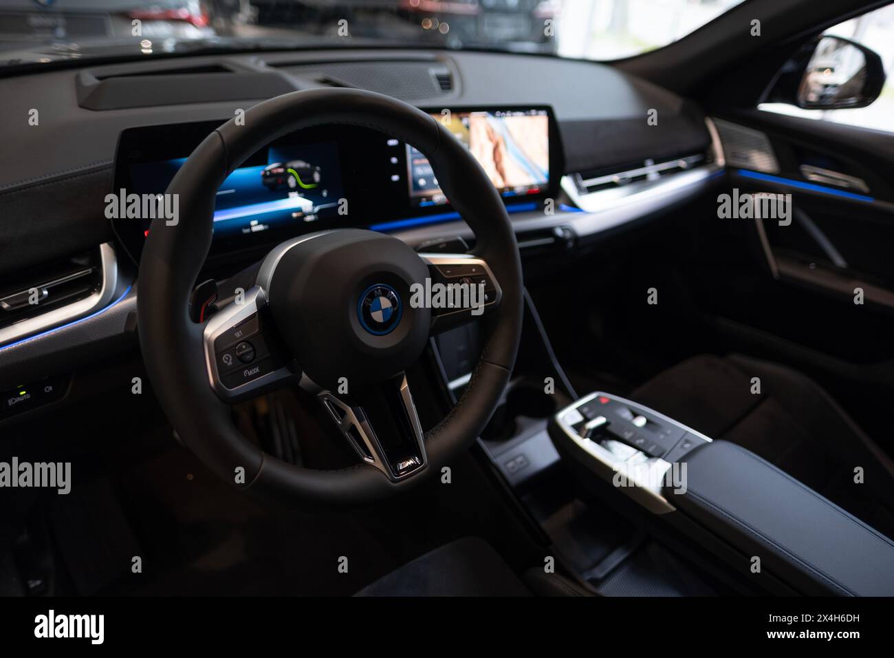 closeup black steering wheel, instrument panel, dashboard, digital ...