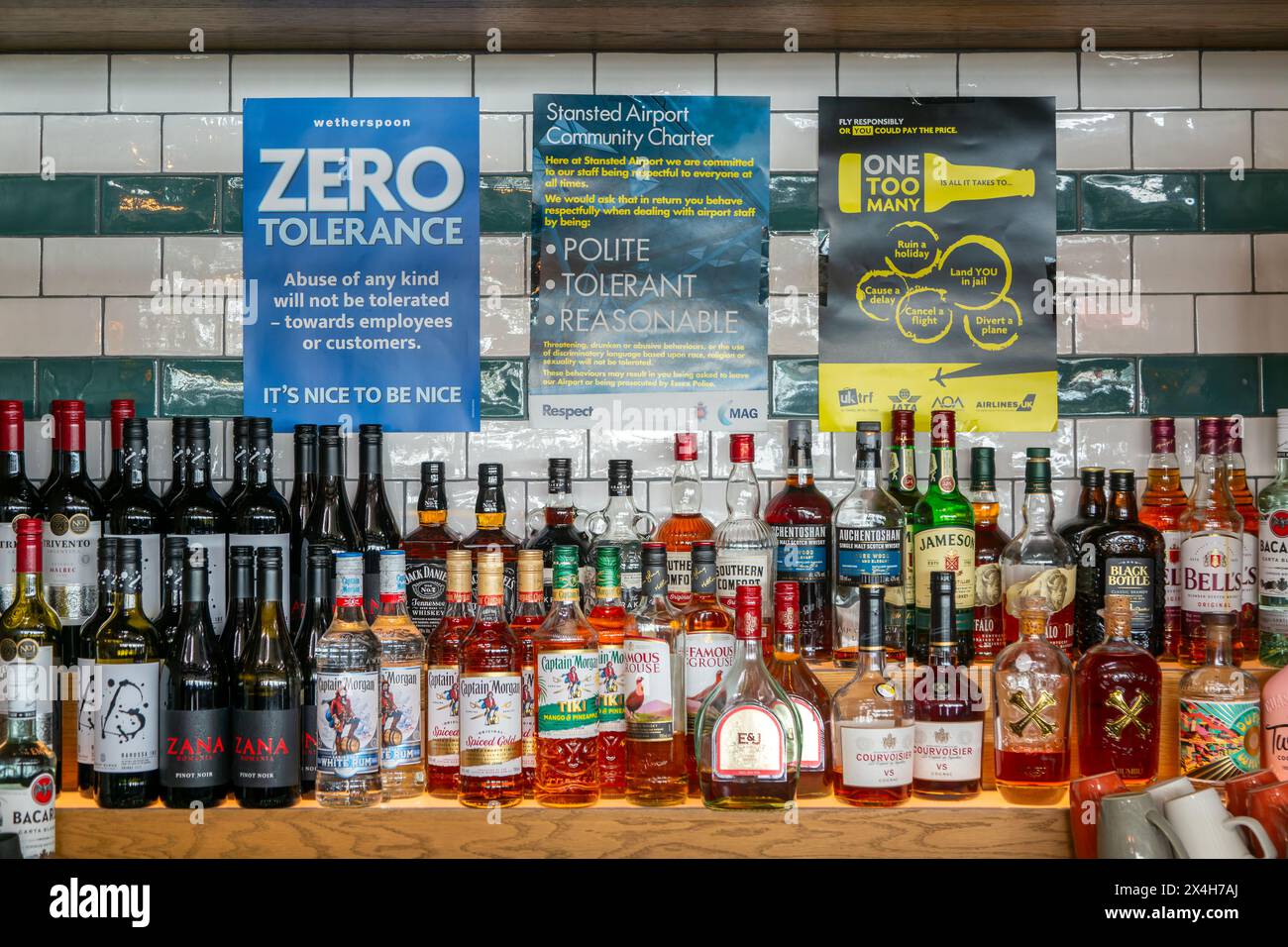 Alcohol bottles and posters about community charter for responsible ...