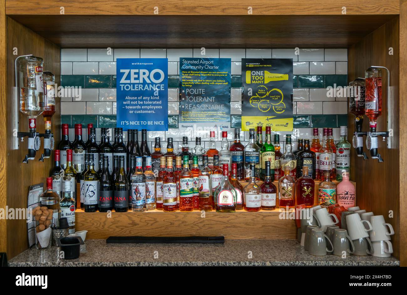 Alcohol bottles and posters about community charter for responsible ...