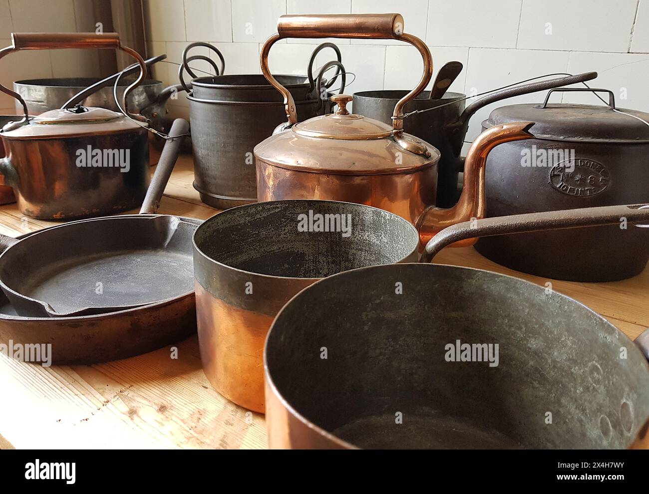 A detail from a display of historic copper kitchen utensils Stock Photo ...
