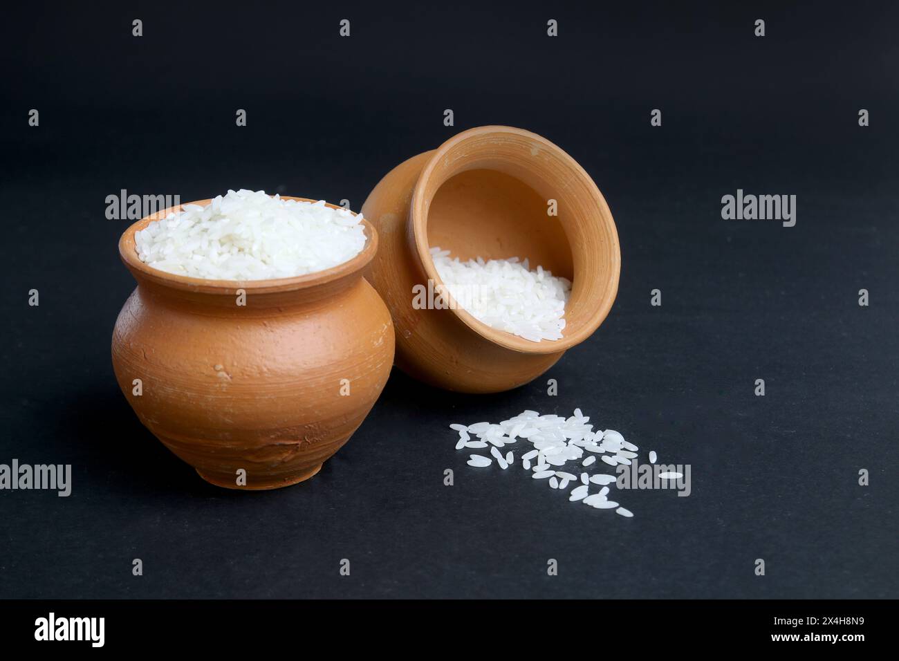 rice grains in the clay pot. traditional mud pot vessel to preserve or ...