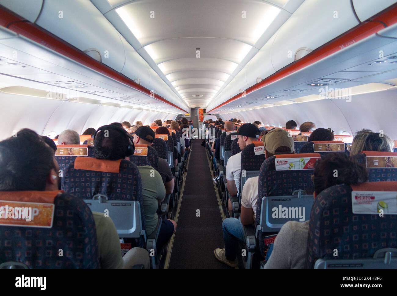 The cabin inside fuselage views down central aisle on a on an Easyjet ...