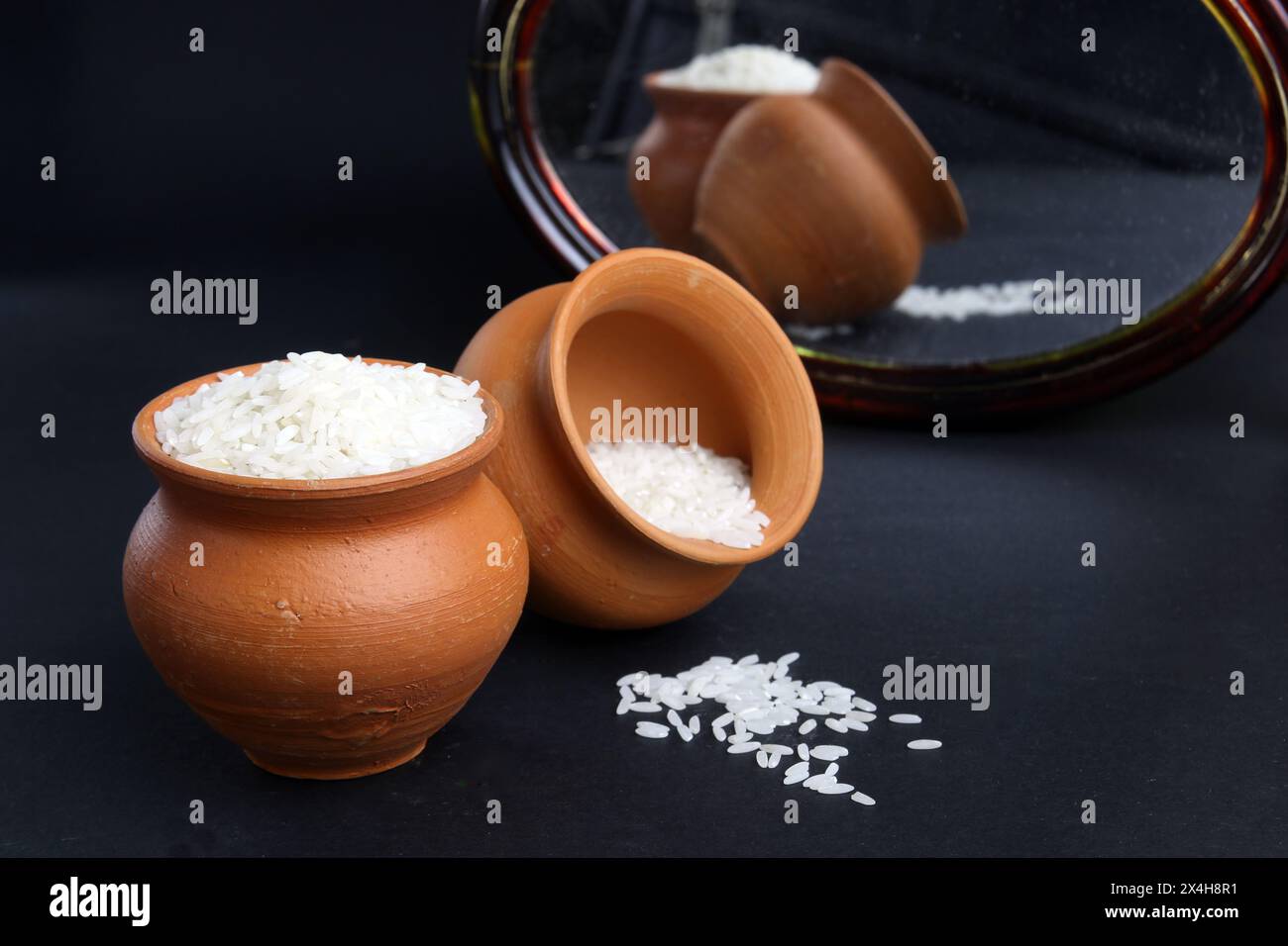 rice grains in the clay pot. traditional mud pot vessel to preserve or ...