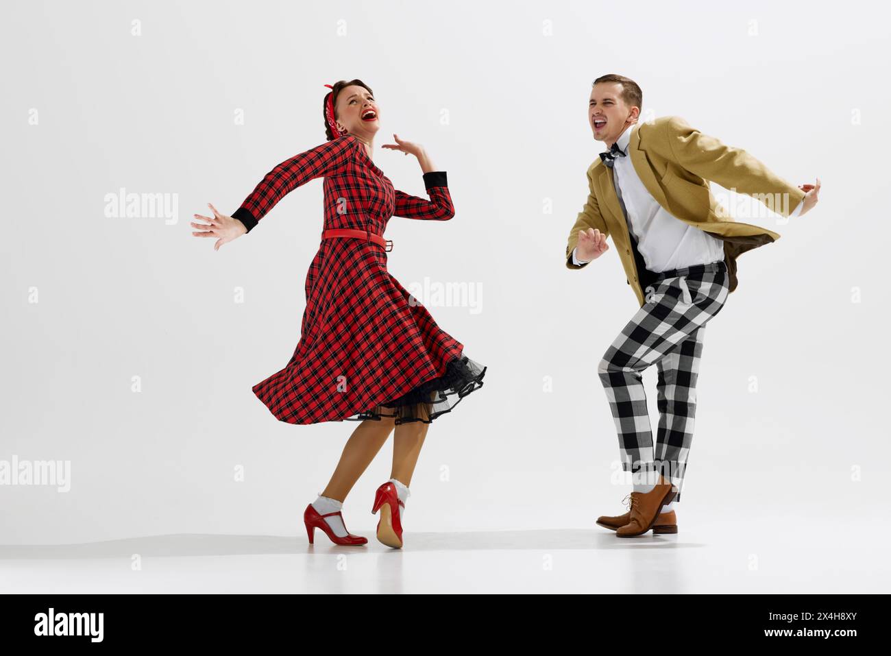 Vibrant dance performance, young couple in period-appropriate attire ...