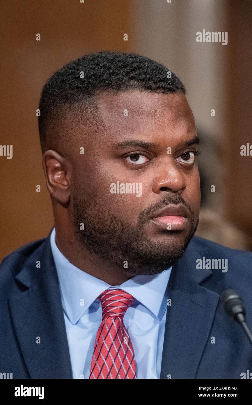 Samuel Cook, MD, Resident, Morehouse School of Medicine, appears before ...