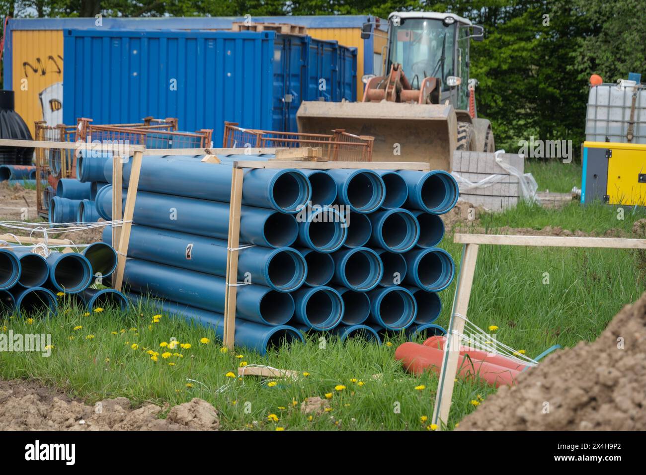 There are many blue pipes on a large construction site Stock Photo - Alamy