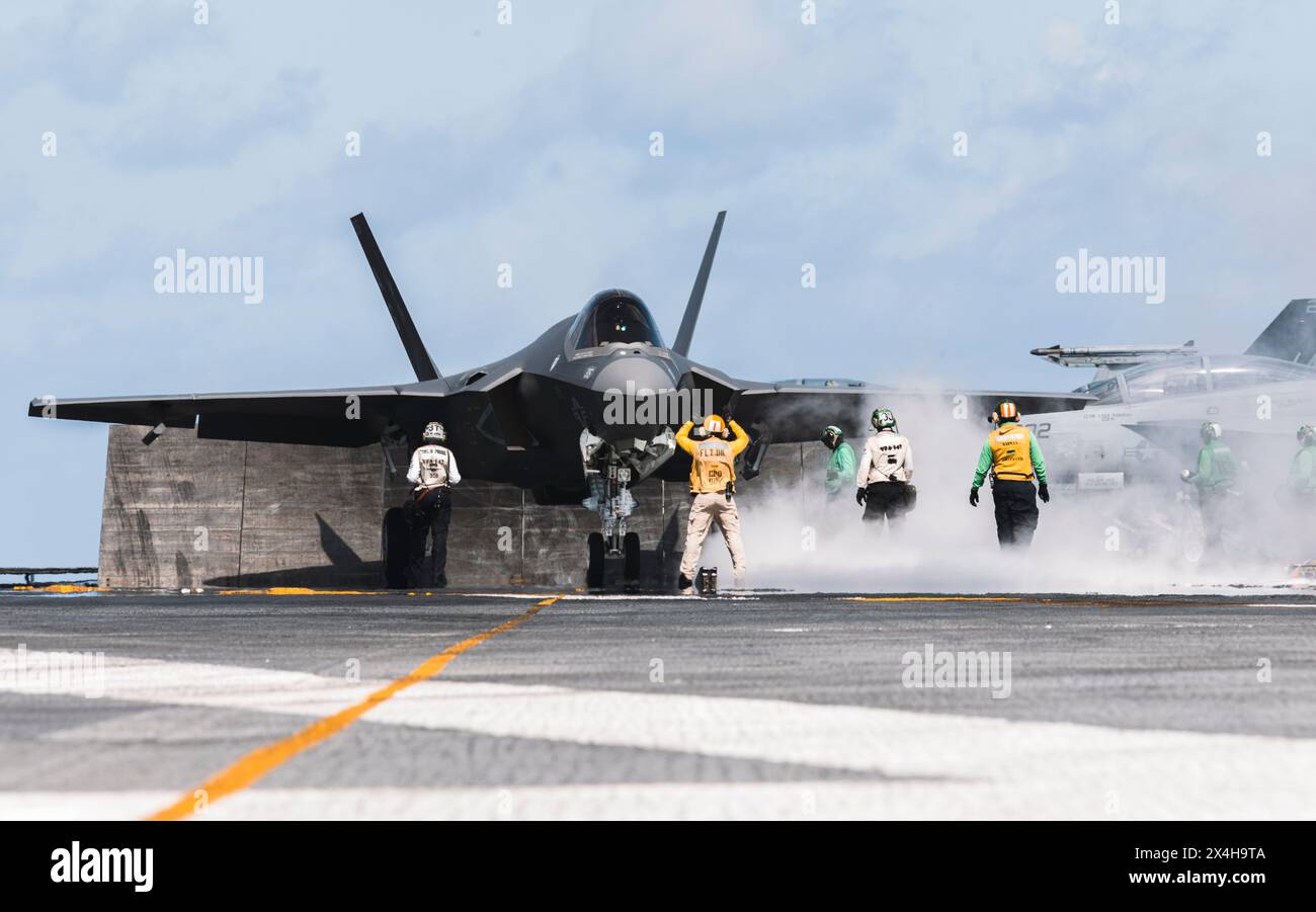 An F-35C Lightning II attached to Strike Fighter Squadron (VFA) 147 prepares for takeoff on ...