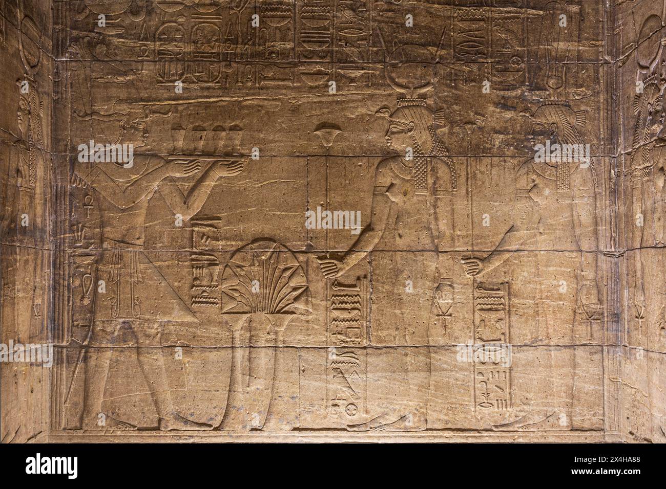 A relief of a pharaoh making an offering to the goddess Isis inside the ...