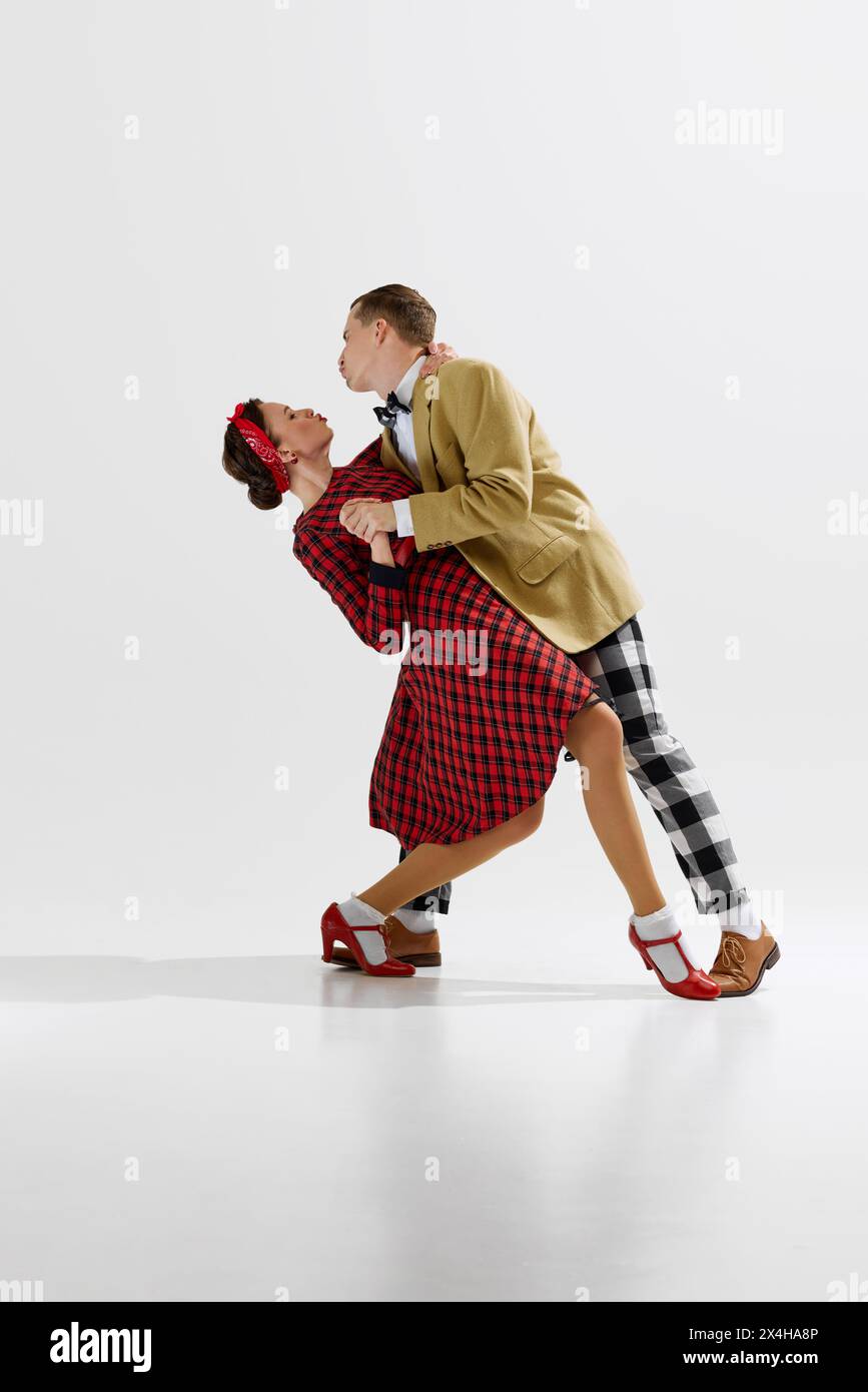 Elegant young couple man and woman in stylish period attire dancing ...