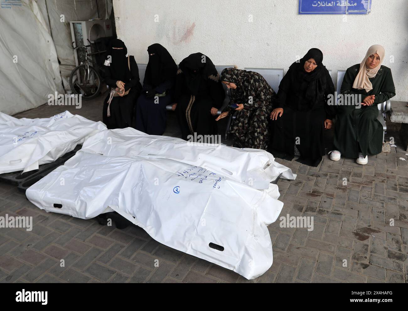 Rafah, Gaza. 03rd May, 2024. Relatives mourn over the bodies of family ...