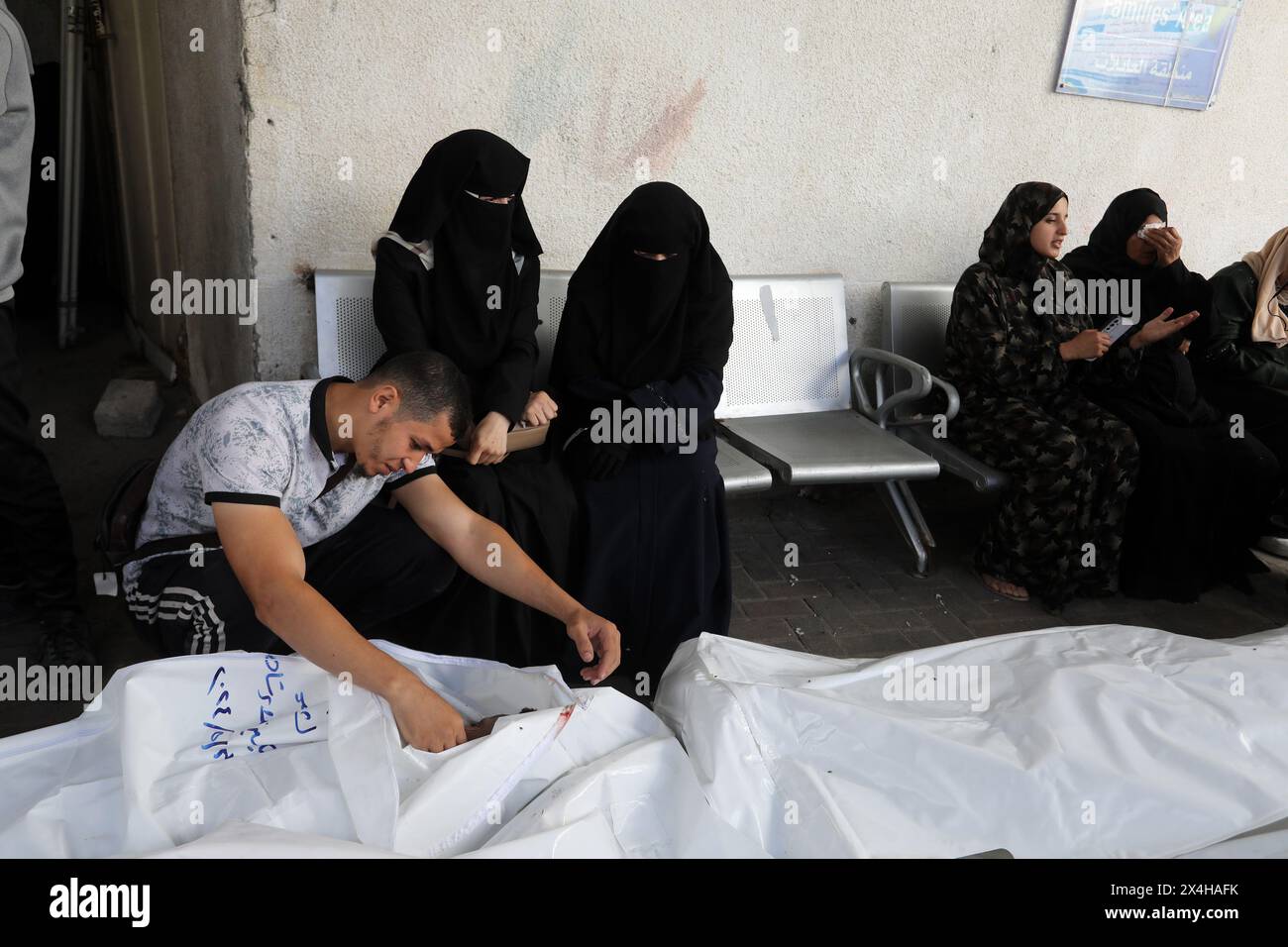 Rafah, Gaza. 03rd May, 2024. Relatives mourn over the bodies of family ...