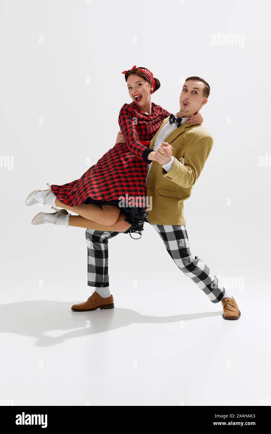 Fun and energetic retro dance scene featuring man and woman dressed in ...