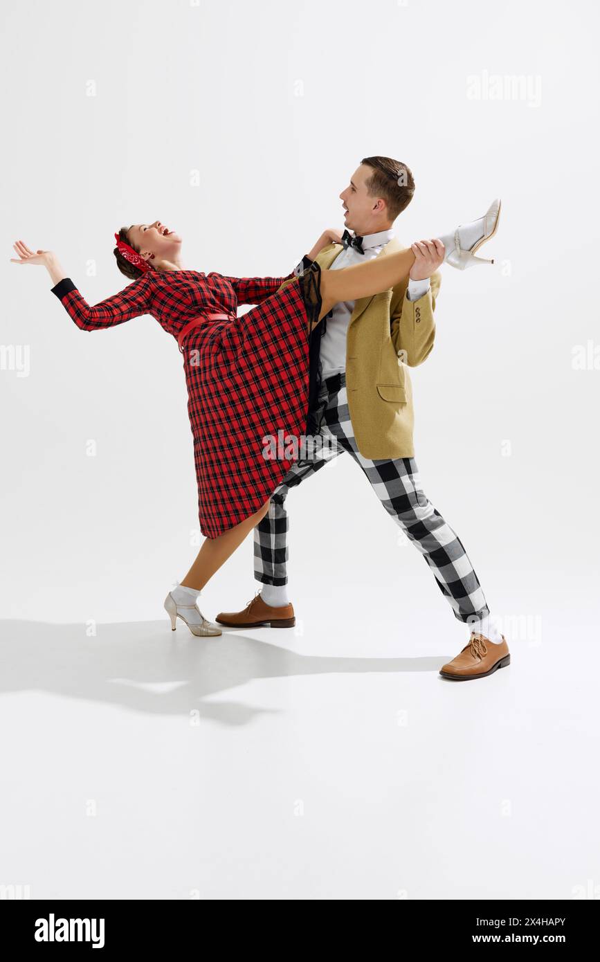 Playful moment captured between a dancing couple, young handsome man ...