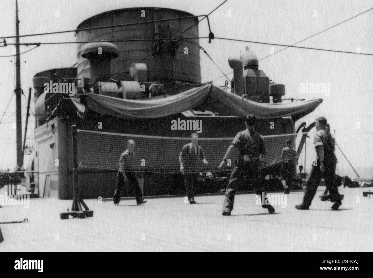 1940s – A group of British army soldiers playing Tennikoit on the deck ...