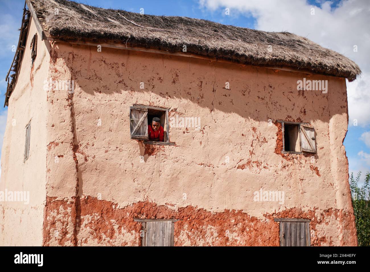 Ivato, Madagascar - April 26, 2019: Typical clay house with wood and ...