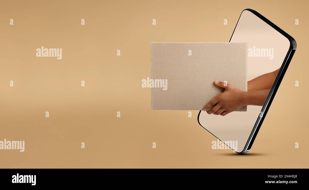Courier passing parcel through smartphone on dark beige background ...