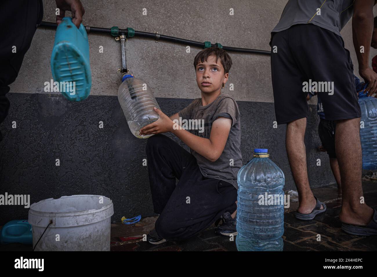 Gaza, Gaza, Palestine. 3rd May, 2024. A Palestinian child bottles water ...