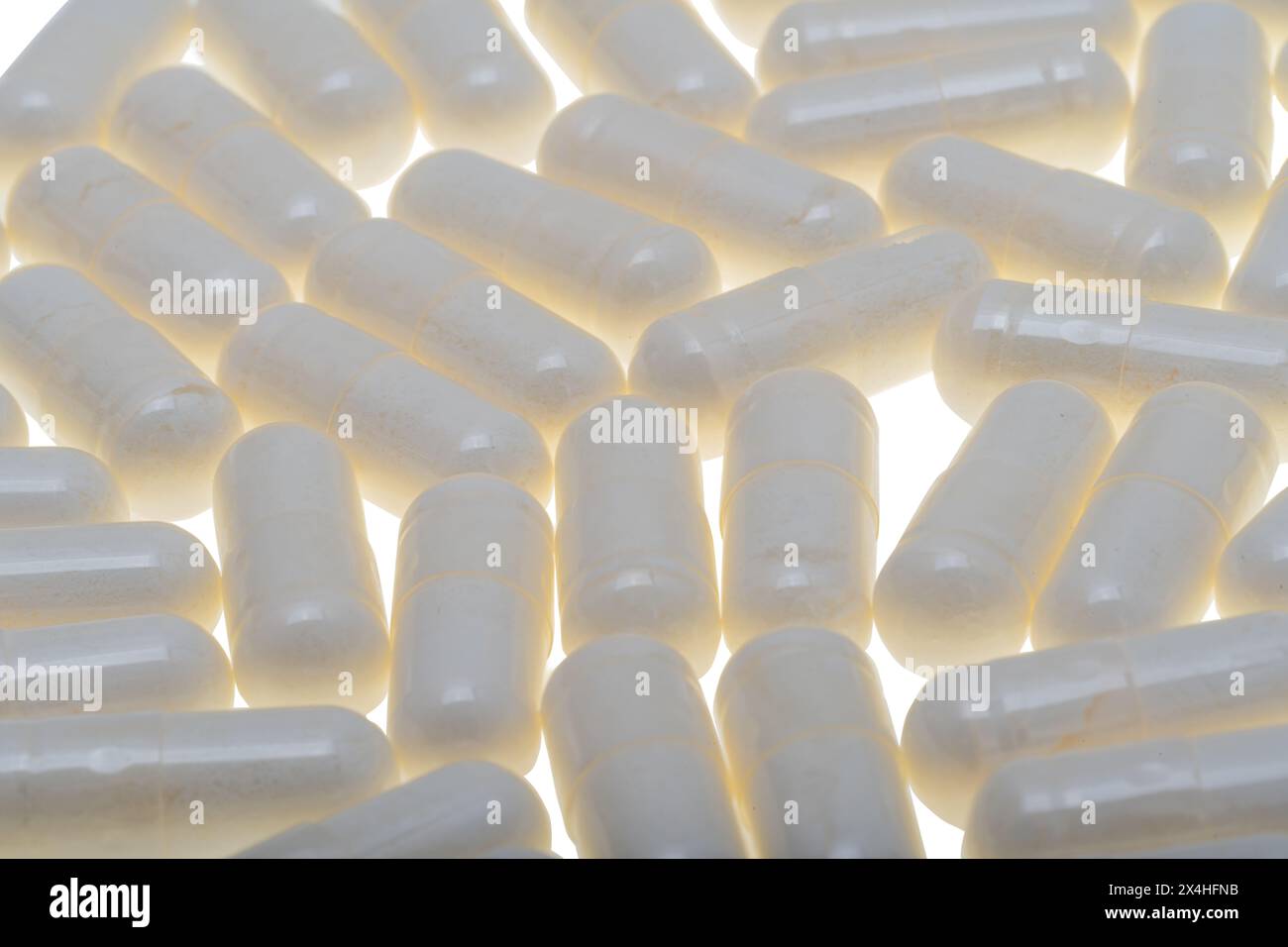 white capsules isolated on white background Stock Photo - Alamy