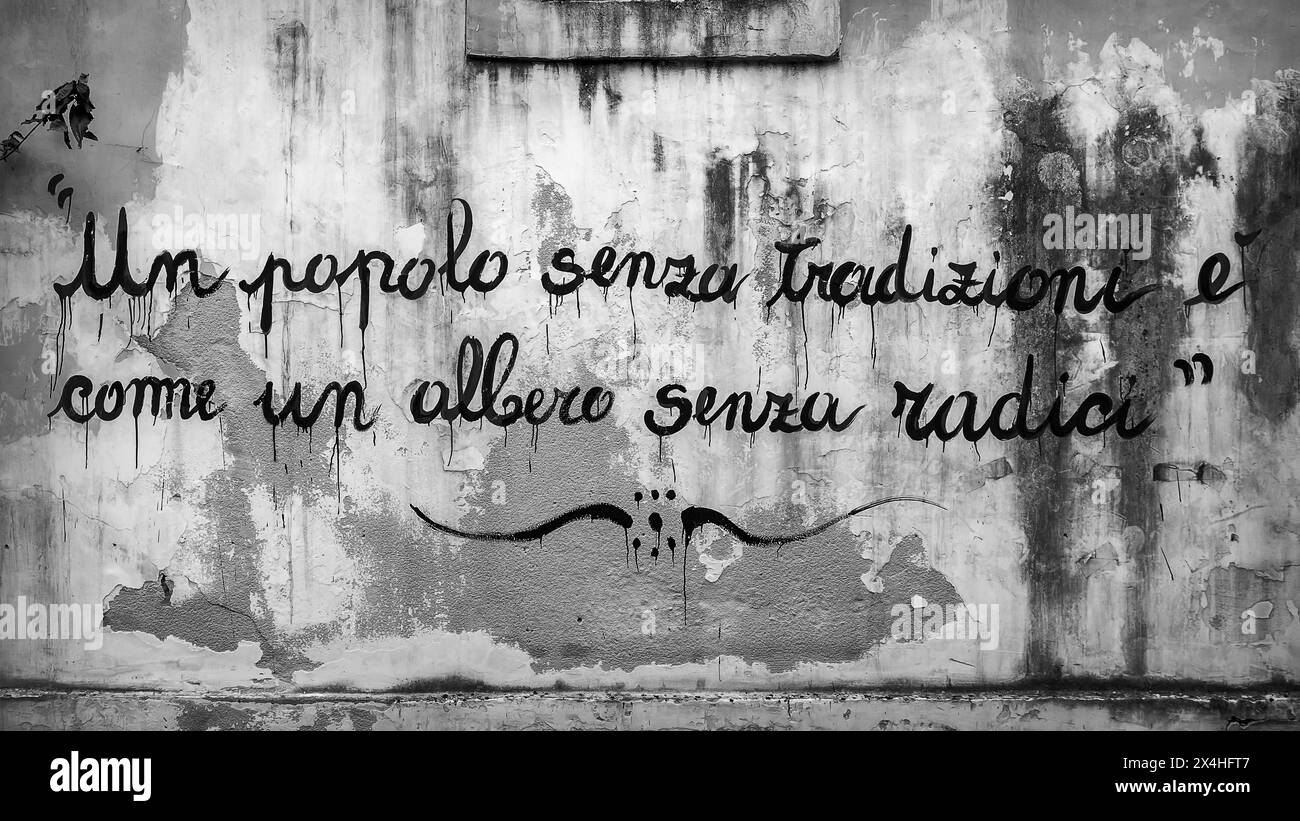 a sentence written on a wall says: "a people without tradition is like ...