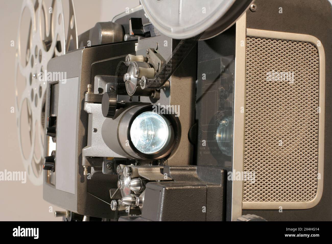 Bell and Howell film projector running with lamp on Stock Photo - Alamy