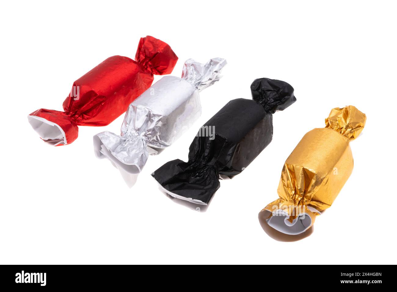 chocolate candies in wrapper isolated on white background Stock Photo ...