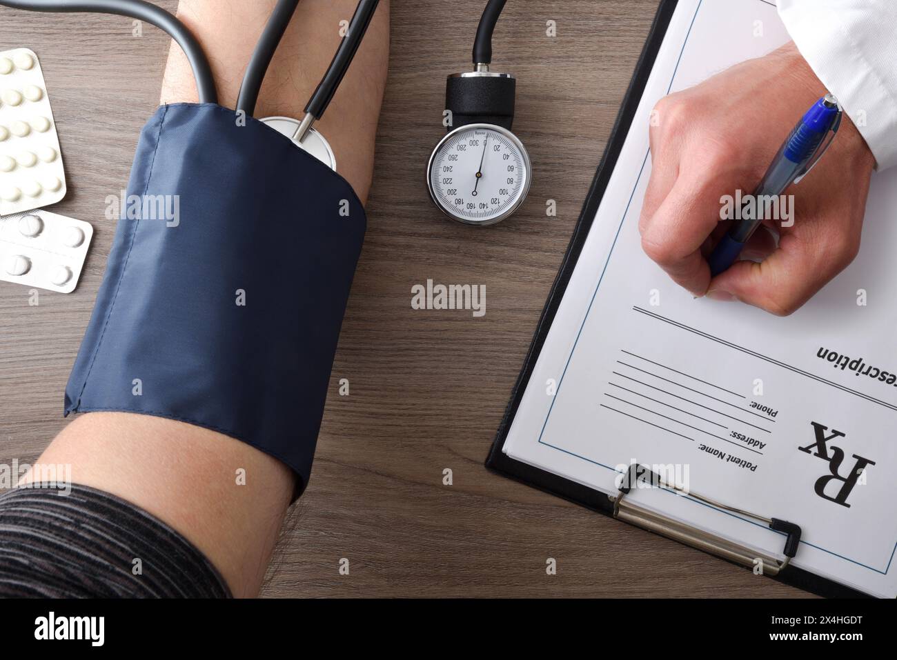 Checking a patient's heart health and blood pressure by a healthcare ...