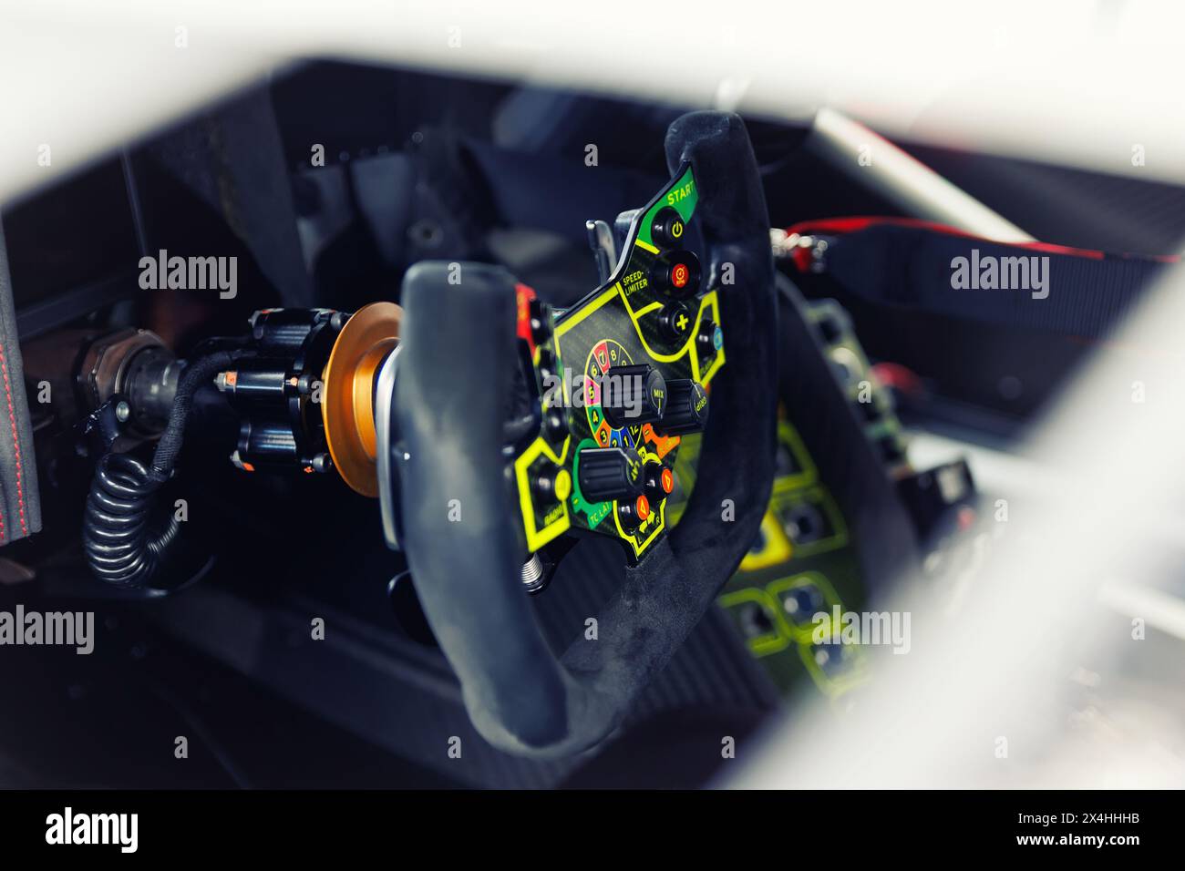 Detailed view of a high-tech racing car steering wheel, gear shift ...