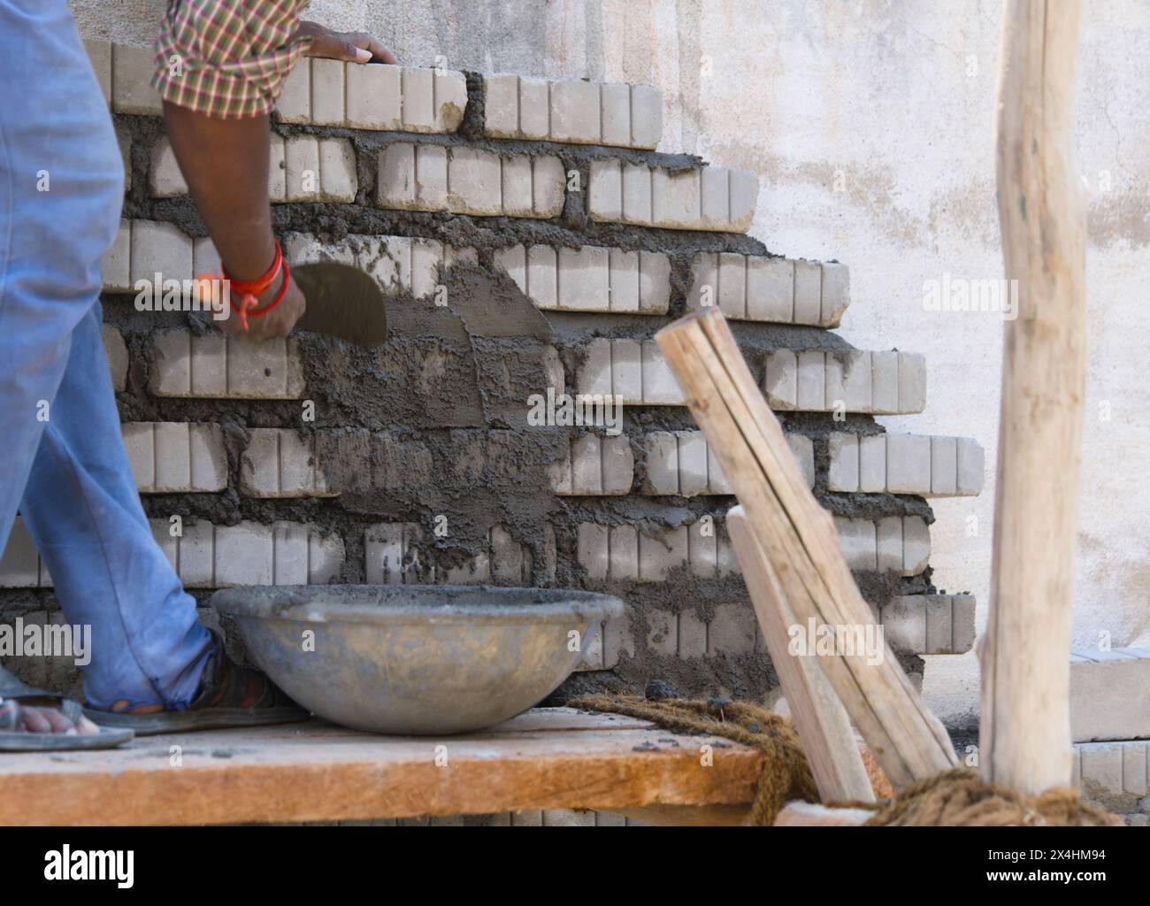 Construction worker applies concrete using hi-res stock photography and ...