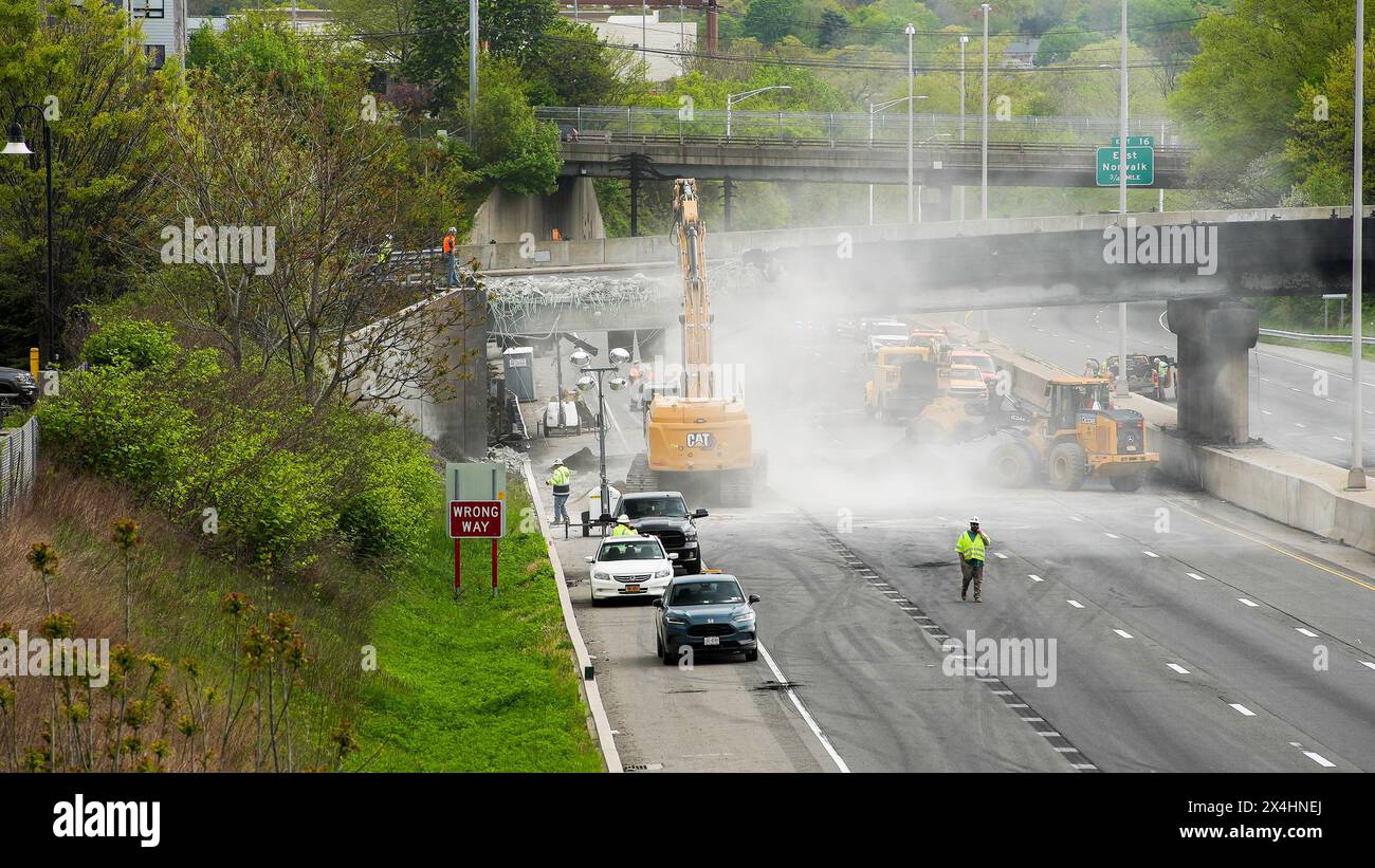 NORWALK, CT, USA- MAY 3, 2024: Demolishing bridge from tractor-trailer ...