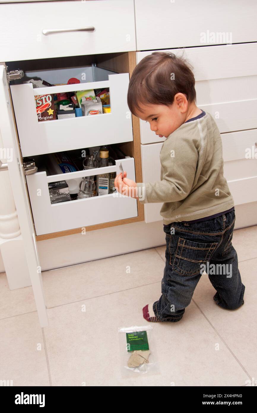 toddler getting into food cupboards Stock Photo - Alamy