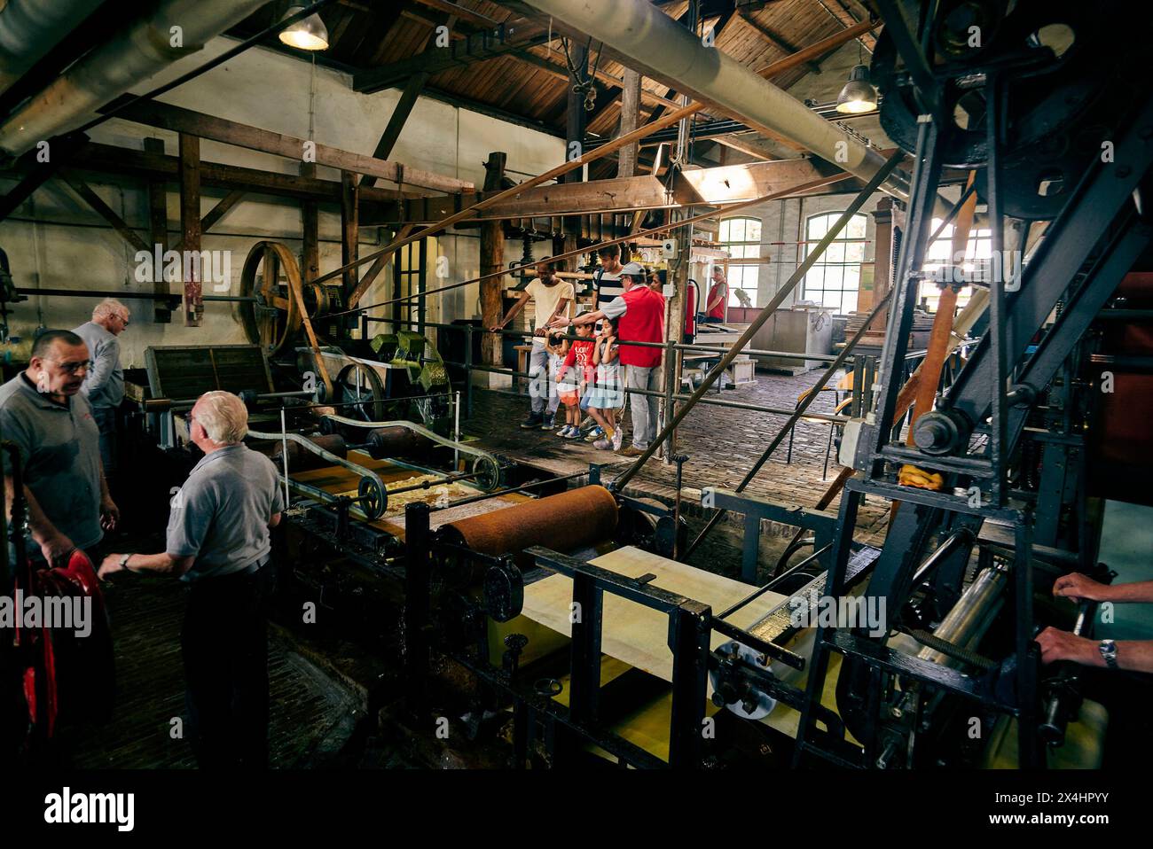 Tourists visit the paper mill De Middelste Molen. Paper mill De ...