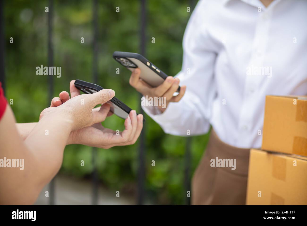 SME business operator is inspecting and packing products into parcel ...