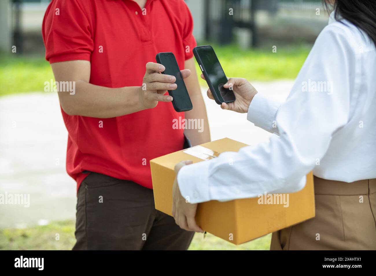 SME business operator is inspecting and packing products into parcel box for delivery company ...