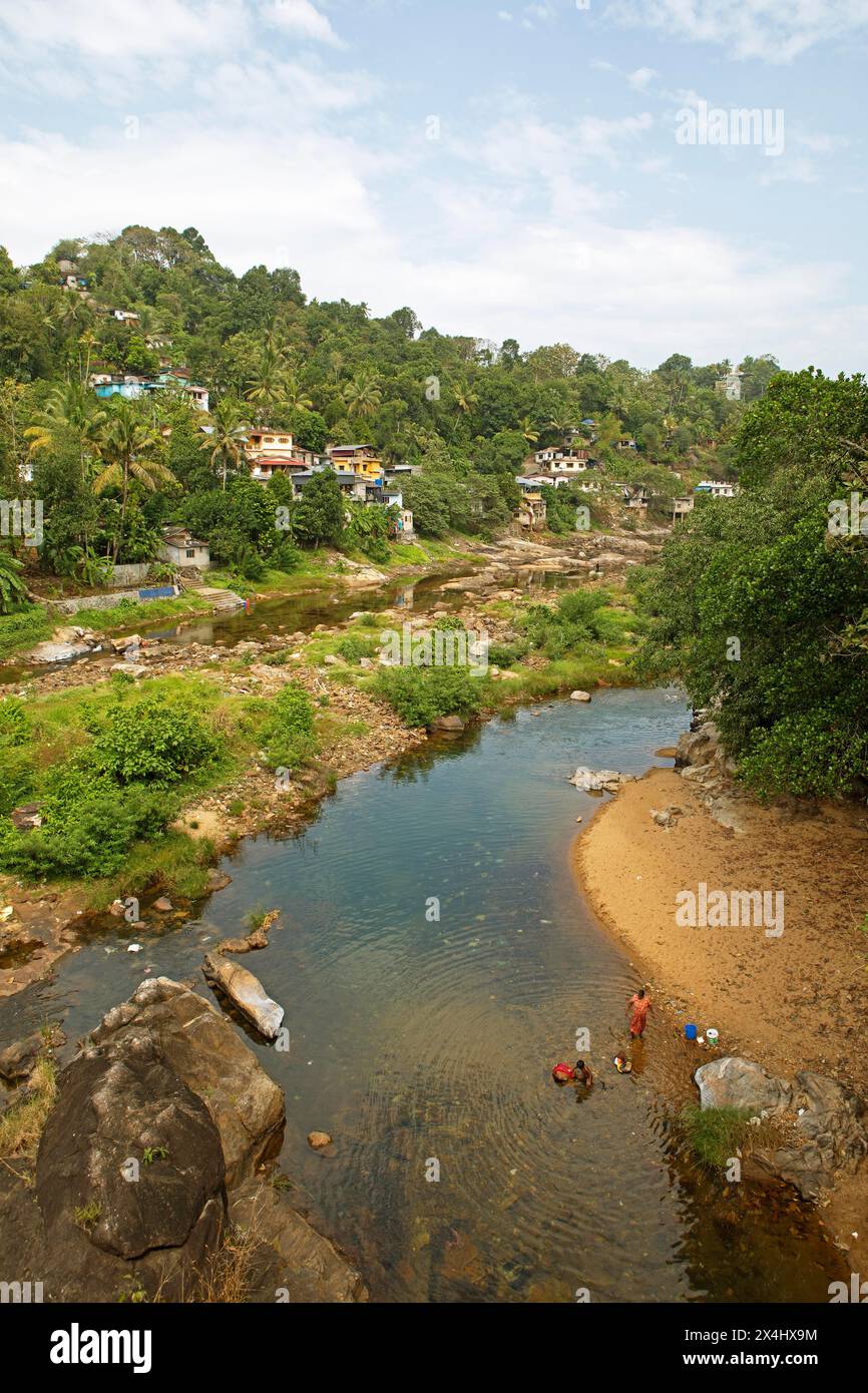 Indian people washing clothes in the Periyar River, Mundakayam, Kerala ...