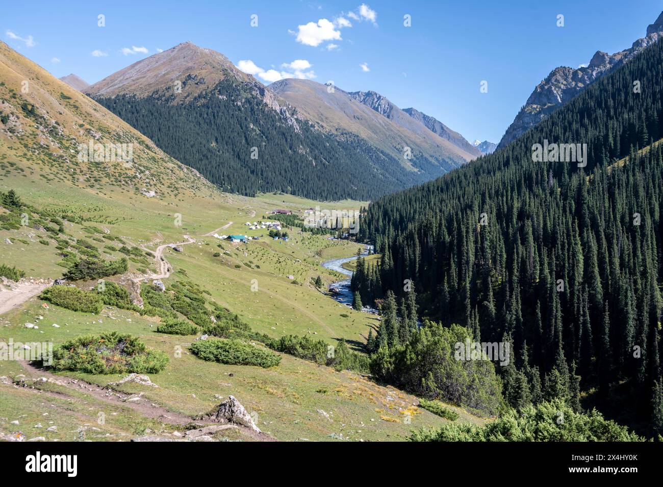 Green mountain valley with the village of Altyn Arashan, Tien Shan ...
