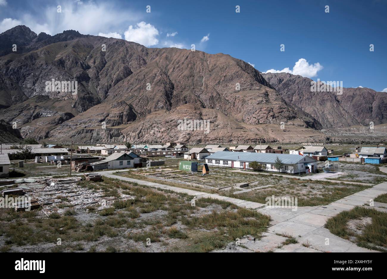 Abandoned buildings in a barren landscape, ghost town of Enilchek in ...