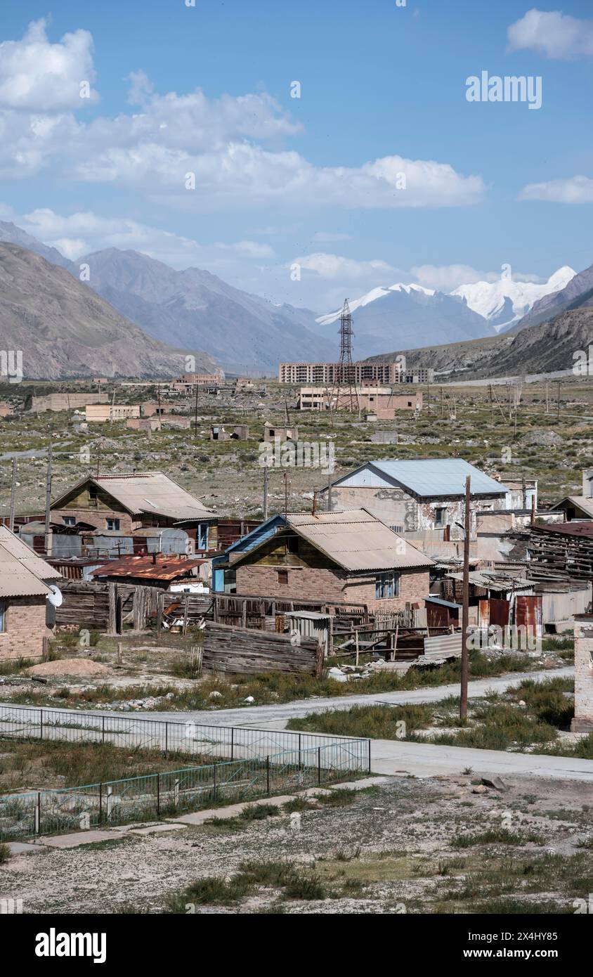Abandoned buildings in a barren landscape, ghost town of Enilchek in ...
