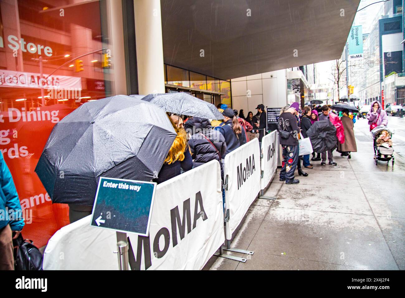 Queue in the rain in front of the Museum of Modern Art MoMa, Midtown ...
