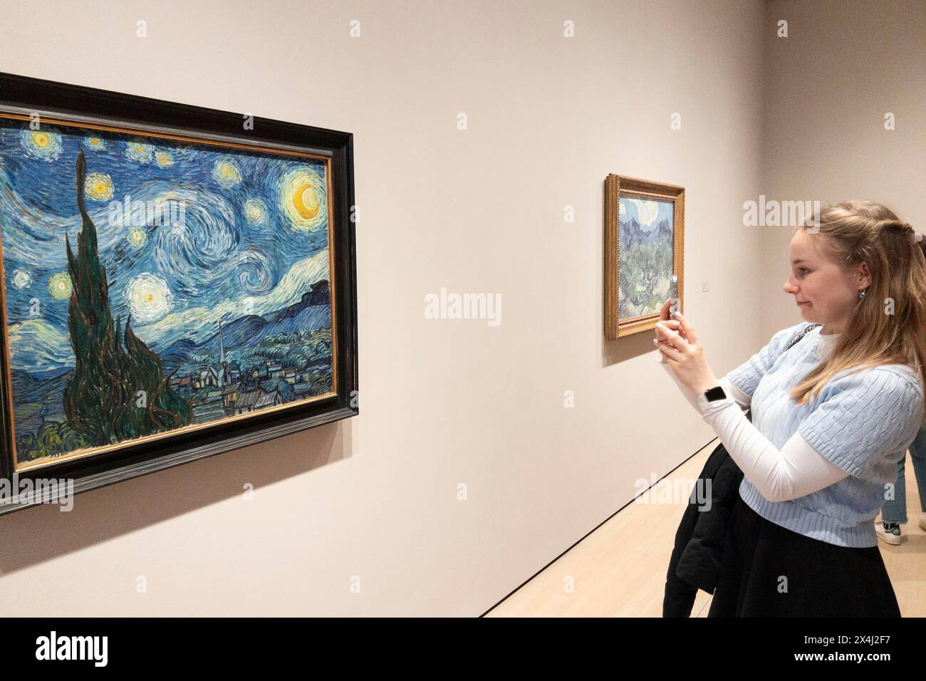 Visitor photographing Van Gogh's painting Starry Night, Museum of ...