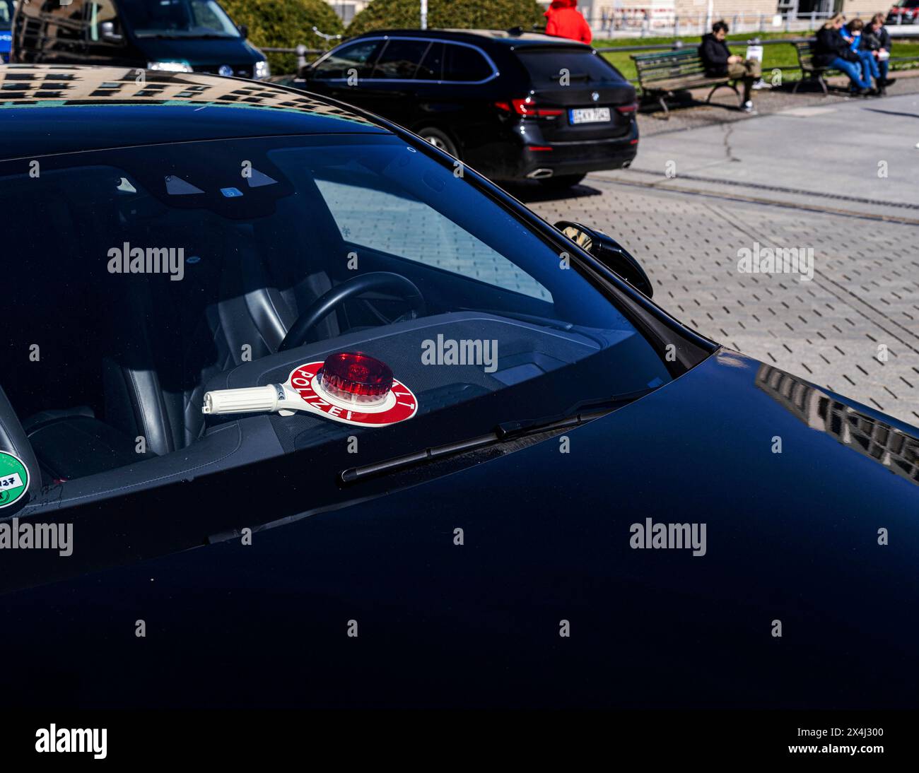 Parked police vehicle with red stop stick behind the windscreen, Berlin ...