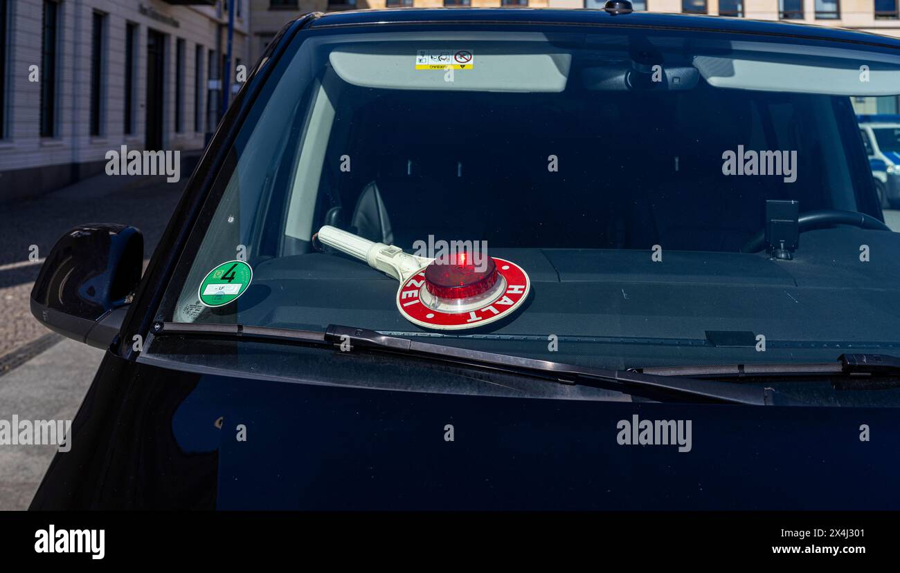 Parked police vehicle with red stop stick behind the windscreen, Berlin ...
