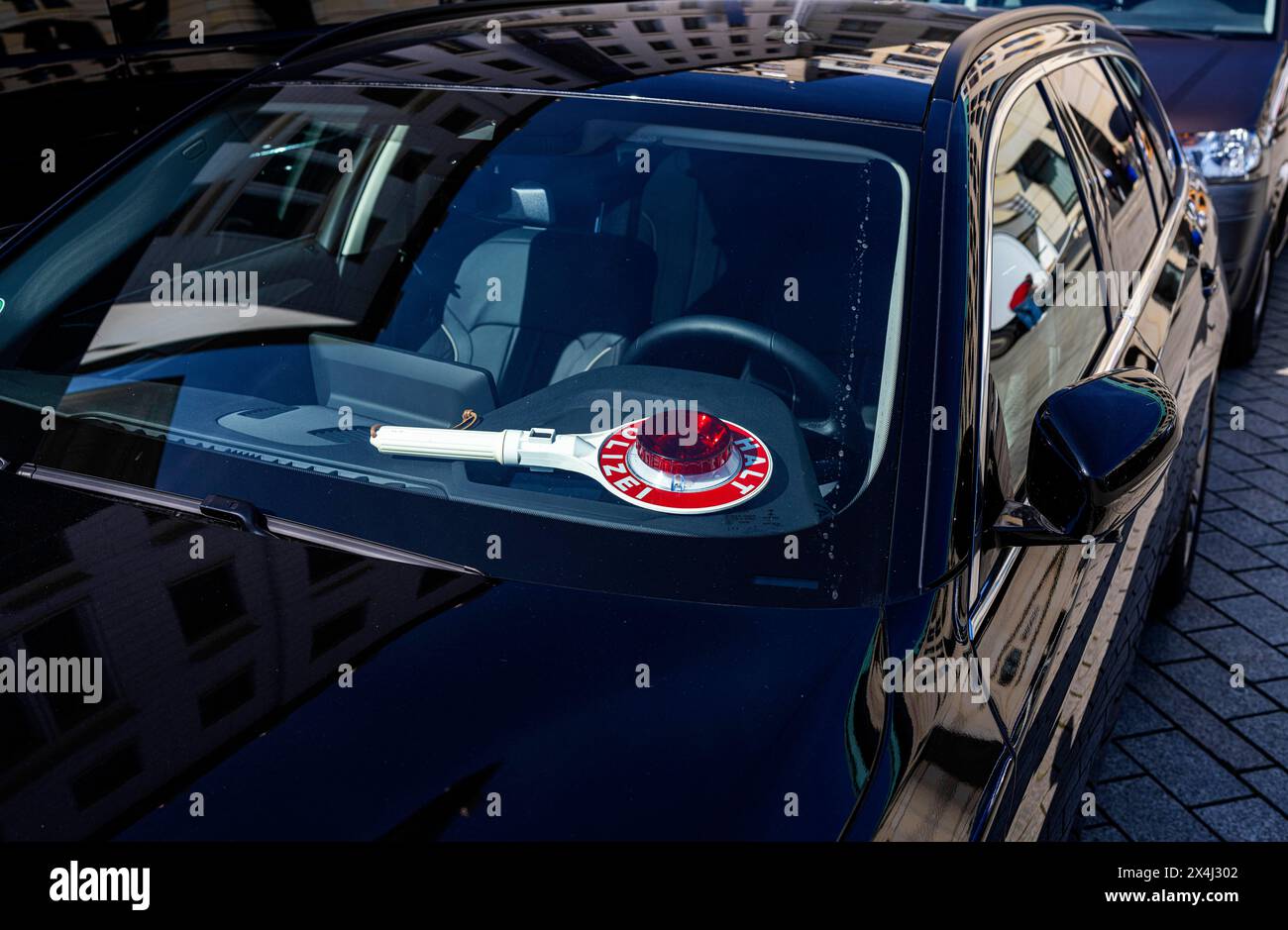 Parked police vehicle with red stop stick behind the windscreen, Berlin ...