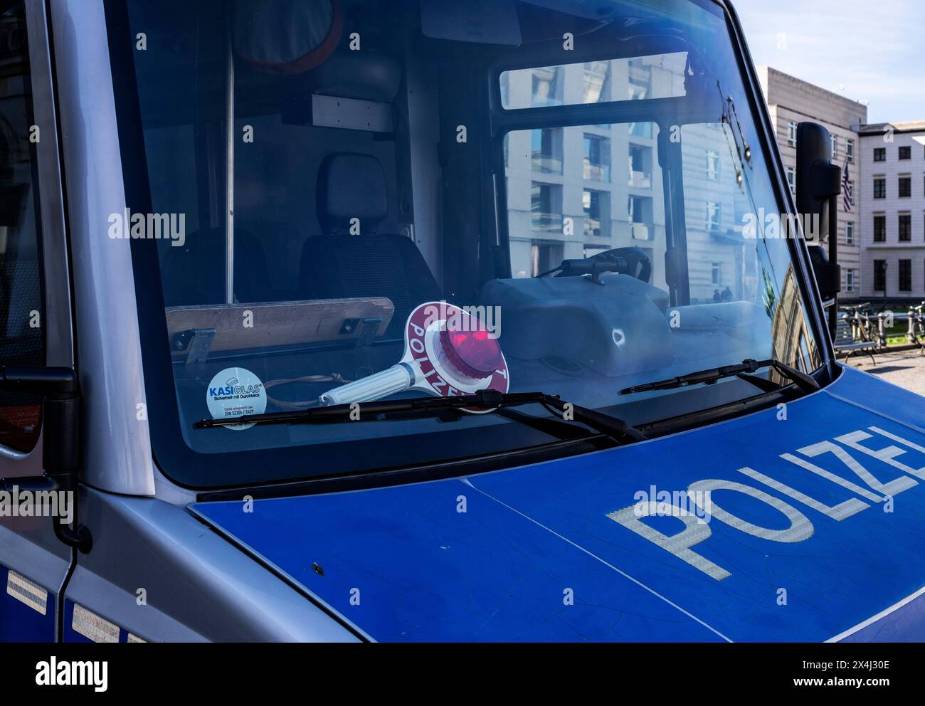 Parked police vehicle with red stop stick behind the windscreen, Berlin ...