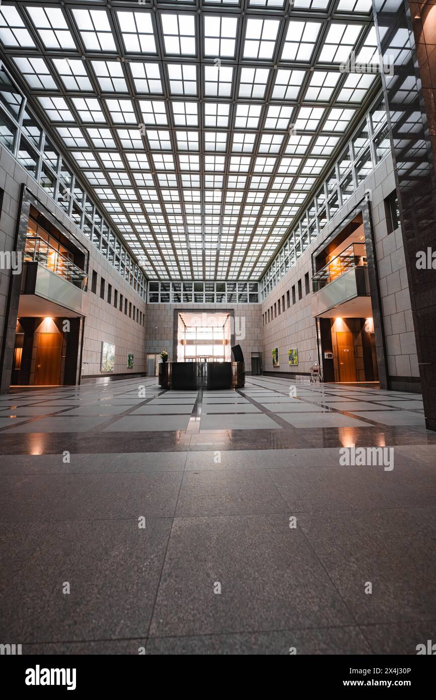 Large interior with glass roof and symmetrical architecture, Berlin ...